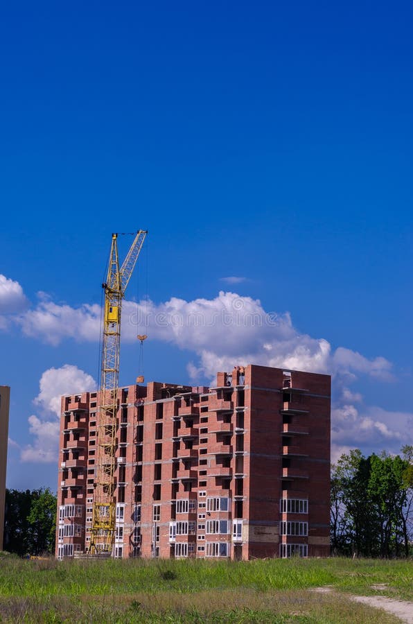 Construction of a Brick High-rise Building with a Crane Stock Image ...