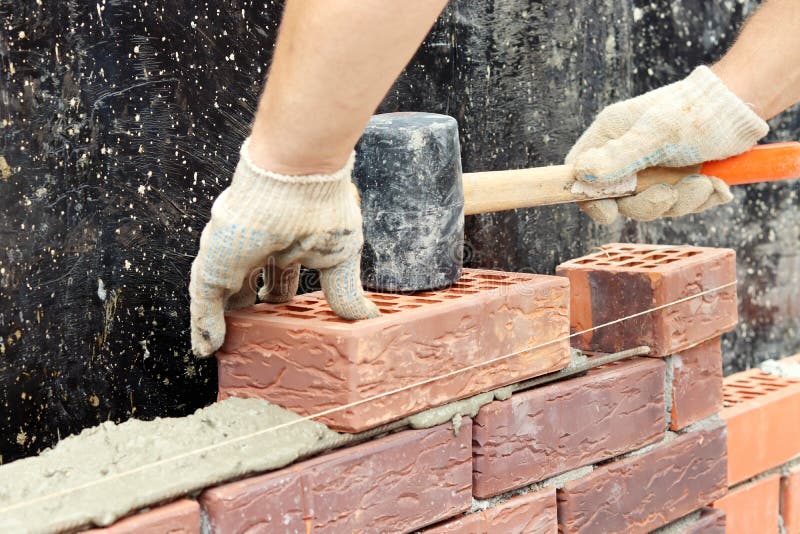 Construction of a Brick Wall. Brick Laying. Selective Focus Stock Photo ...