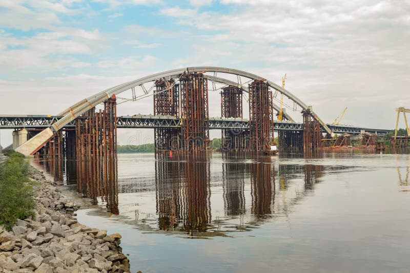Construction of a Bridge Over Wide River Stock Image - Image of ...
