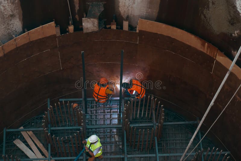 Construction of a Bridge Support in the Excavation. Workers at the ...