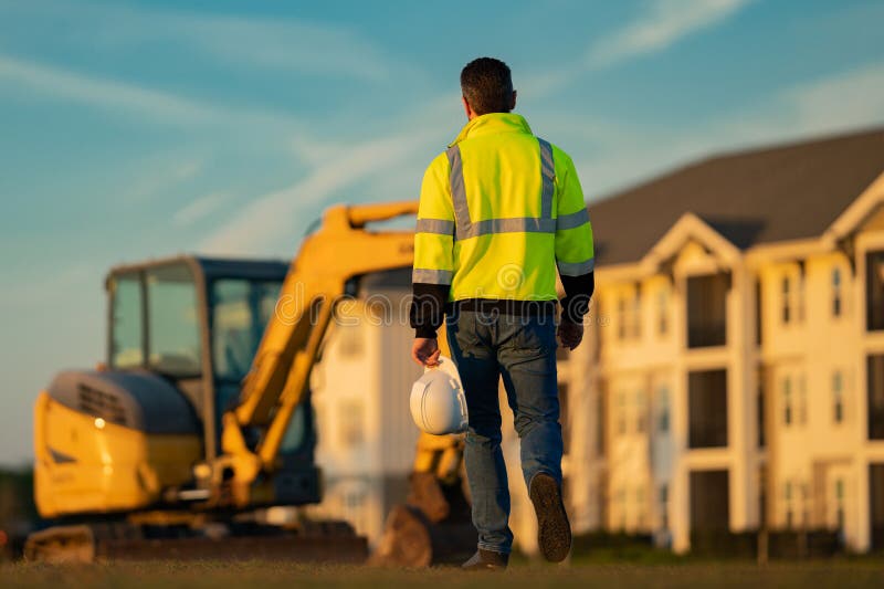 Construction Build Man with Excavator at Industrial Site. Worker in ...
