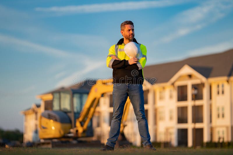 Construction Build Man with Excavator at Industrial Site. Worker in ...