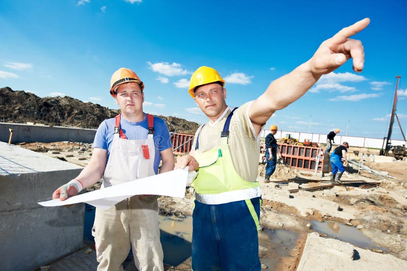 Engineer Builders at Construction Site with Draft Stock Photo - Image ...