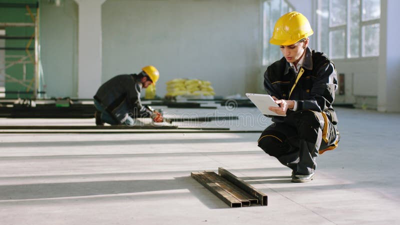 Details Closeup at Construction Site Working Concentrated Constructor ...