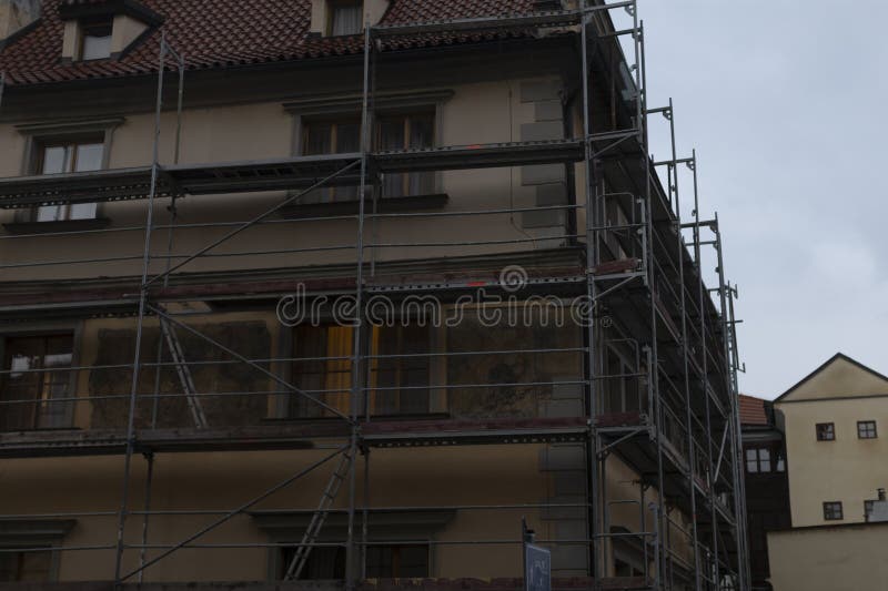 A Construction Building that Has Scaffolding Attached To Its Side Stock ...