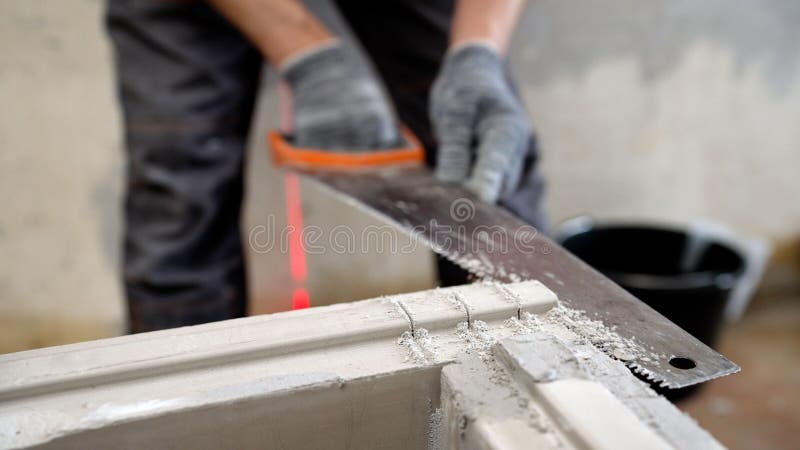 Construction, Building Manual Work. a Builder Saws a Concrete Block ...