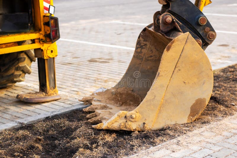 A Construction Bulldozer is Actively Digging a Substantial Hole in the ...