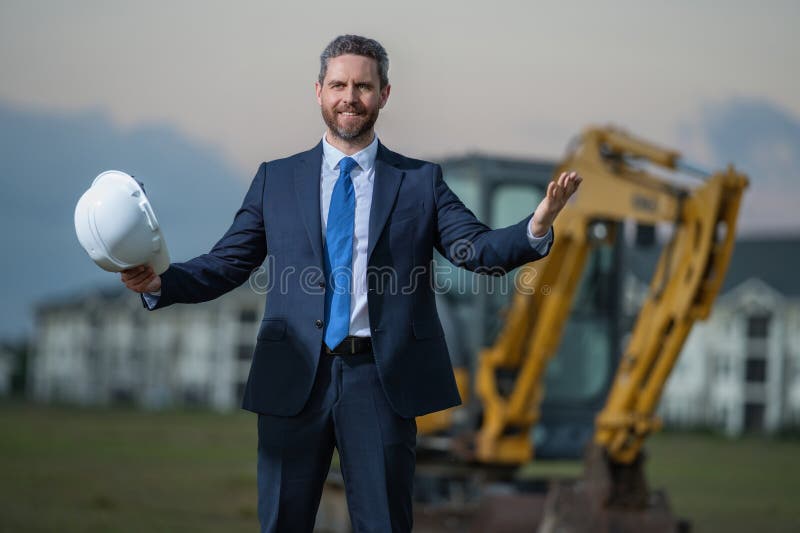 Construction Business Owner. Man in Suit and Hardhat Halmet at Building ...