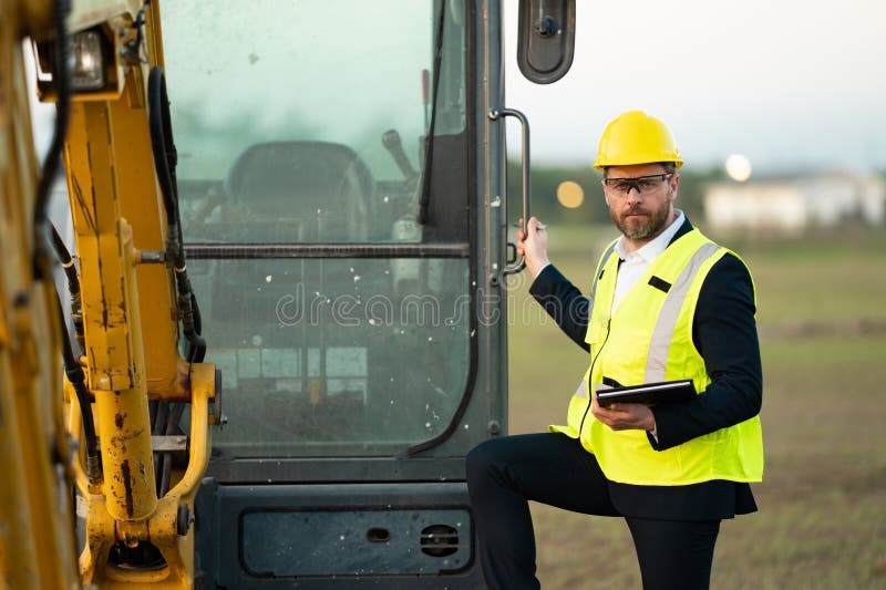 Construction Business Owner. Man in Suit and Hardhat Halmet at Building ...