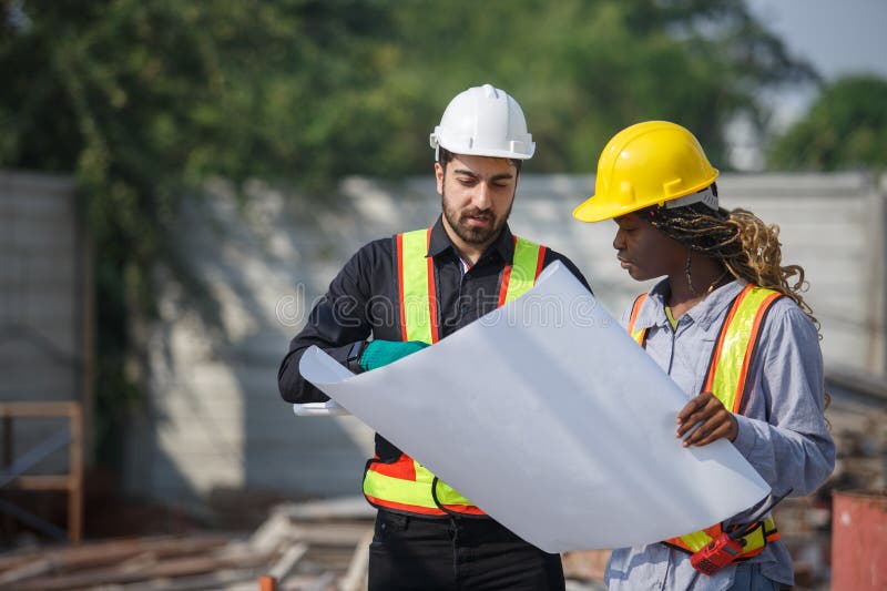 Construction Civil Engineer Man and Woman African American Checking ...