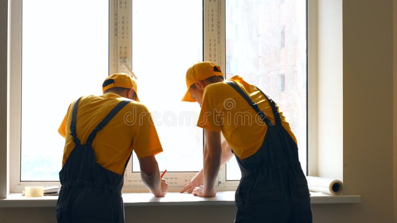 Construction Co-workers Discussing Work Plan. Stock Photo - Image of ...