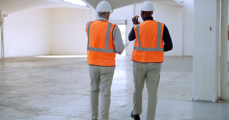Construction, Communication and Men with Teamwork in Warehouse for ...