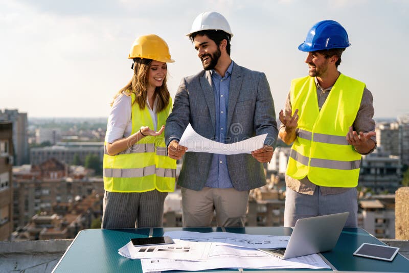 Construction Concept. Engineers and Architects Working at Construction ...