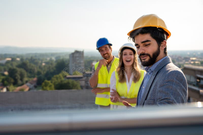 Construction Concept. Engineers and Architects Working at Construction ...