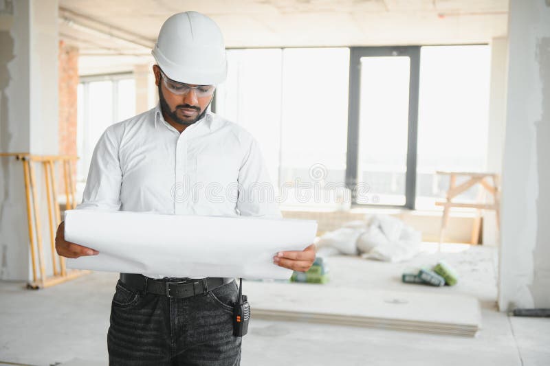 Construction Concept. Portrait of a Young Architect at a Construction ...