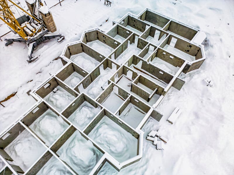 Construction of Concrete Foundation with Snow Coverage on Ground at a ...