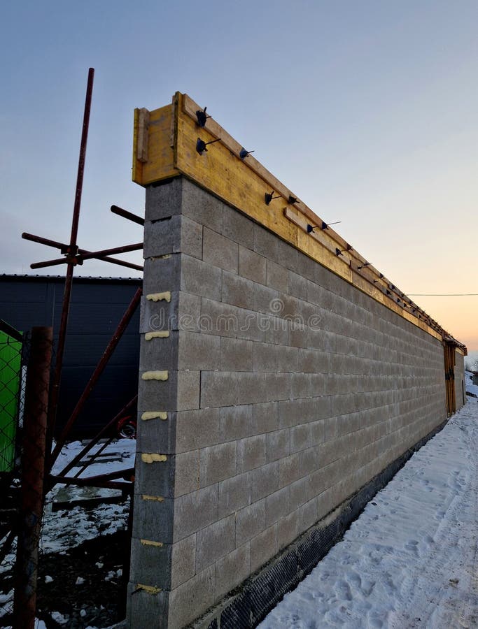 Construction of a Concrete Wall from Concrete Blocks Filled Inside with ...