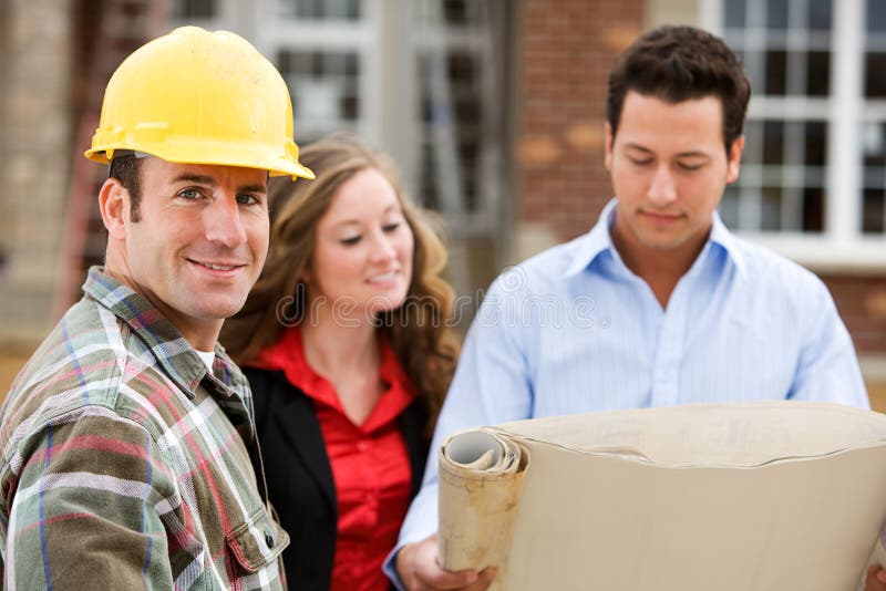 Construction: Contractor with Agents Behind Stock Image - Image of ...