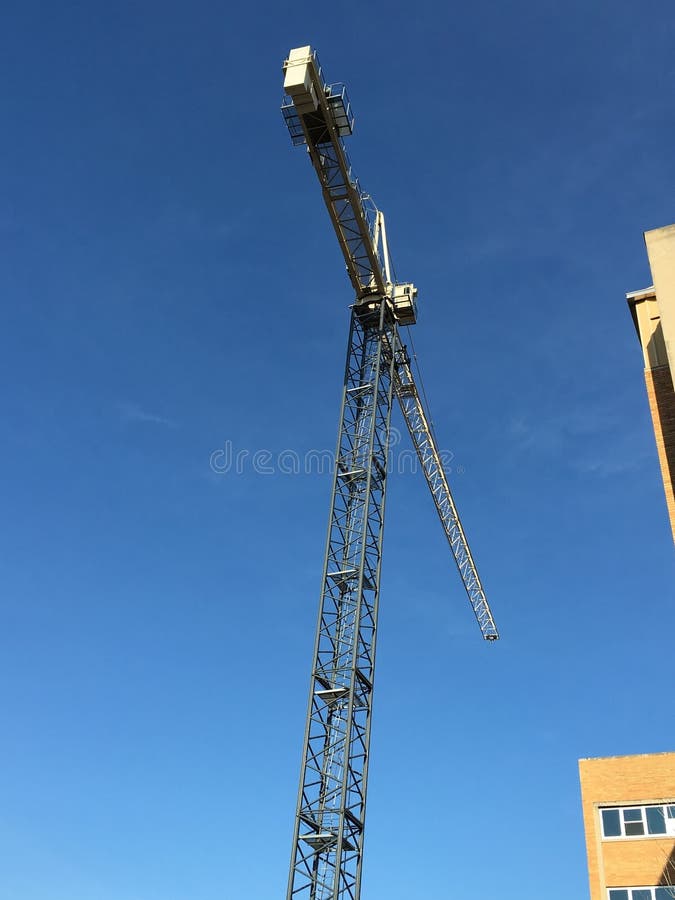 Construction Crane Against a Cloudless Turquoise Sky Stock Photo ...