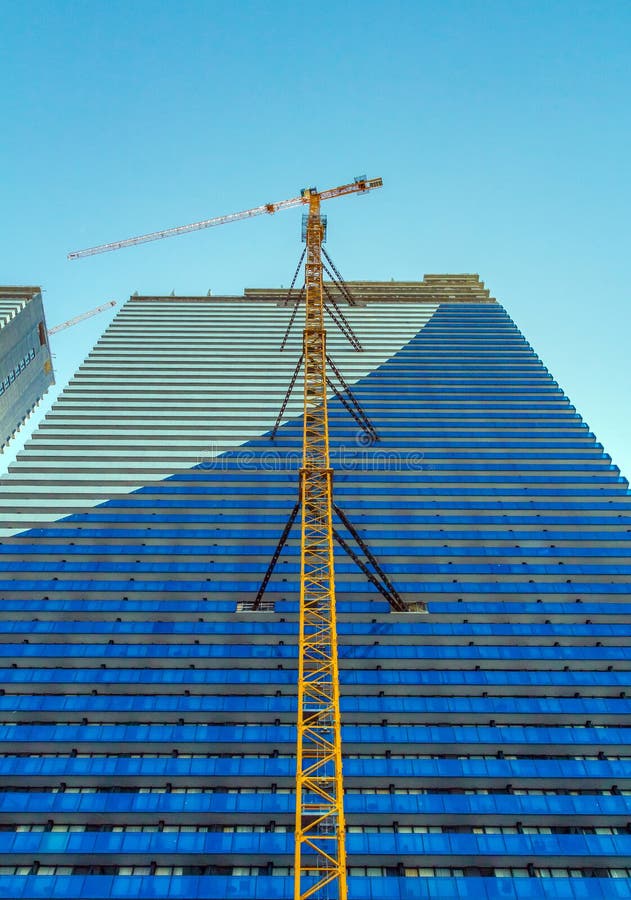 Construction Crane Attached To Building Stock Photo - Image of high ...