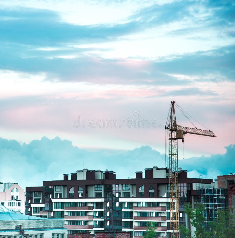 Construction Crane on the Background of the Structure at Sunrise ...