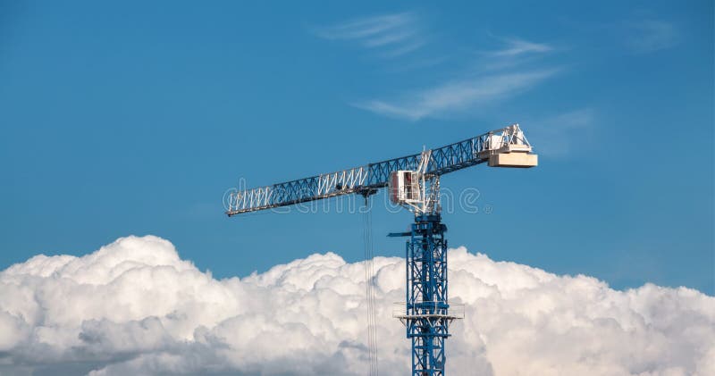 Construction Crane Blue and White Above the Clouds on the Blue Sky ...