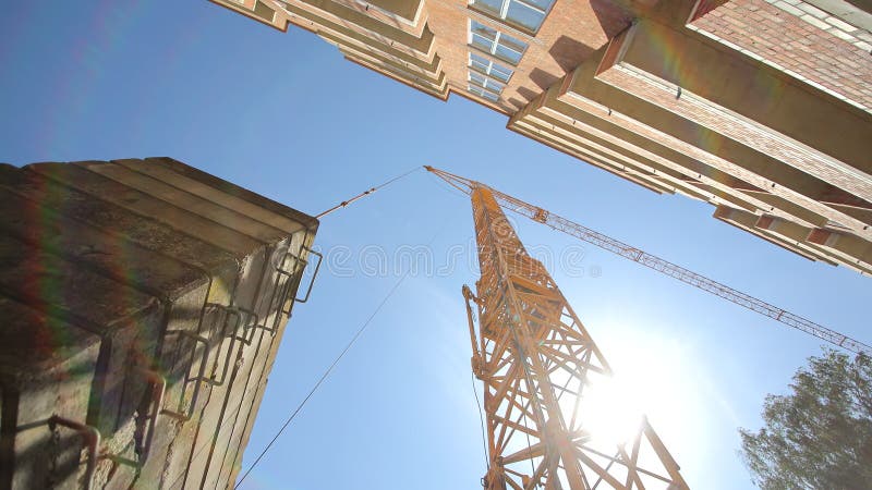 Construction Crane Bottom View. Construction of a House. the Sun S Rays ...