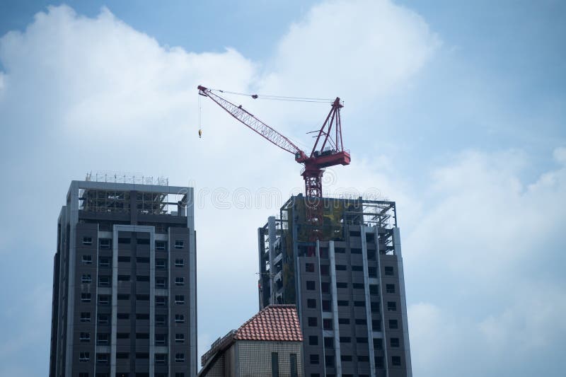 Construction Crane and Building Against Blue Sky Stock Image - Image of ...