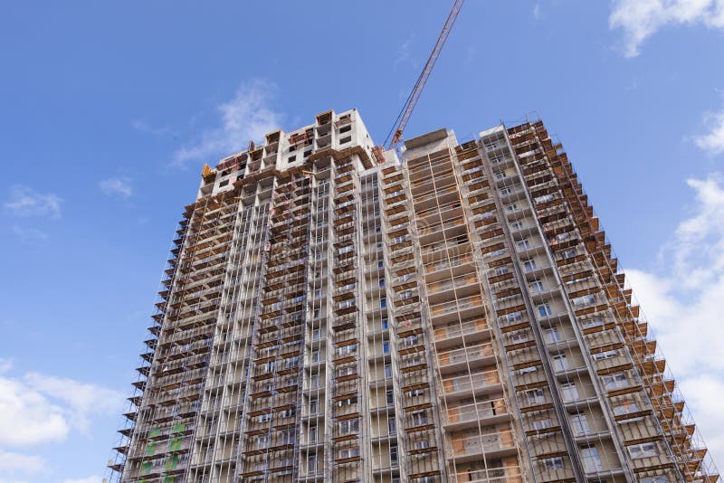 Construction Crane Building a New High-rise Skyscraper or Apartment ...