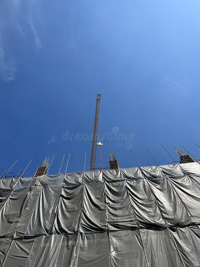 Construction Crane and Building Under Blue Sky Stock Image - Image of ...