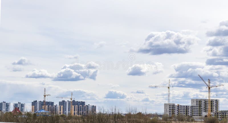 Construction Crane and Buildings Under Construction on the Background ...