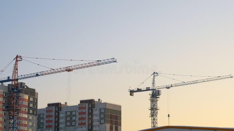 Two Cranes Building a House Stock Photo - Image of skyscraper, metal ...