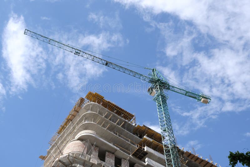 Construction Crane during the Construction of a High-rise Building ...