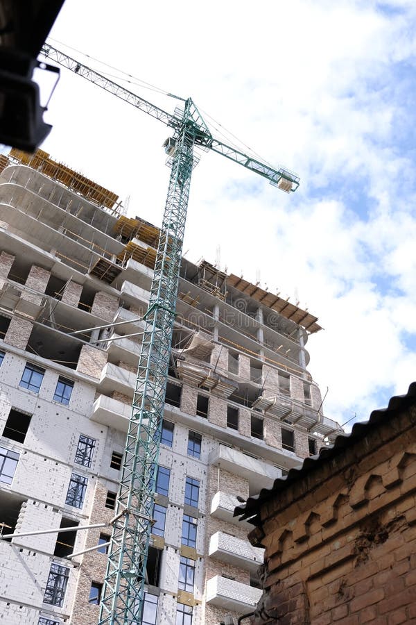 Construction Crane during the Construction of a High-rise Building ...