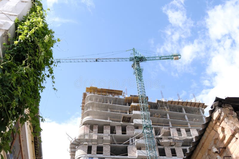 Construction Crane during the Construction of a High-rise Building ...