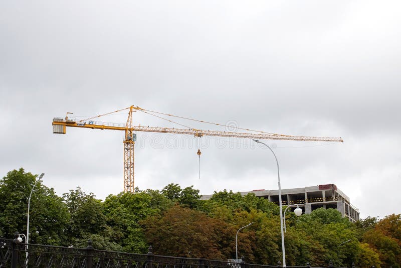 Construction Crane and Construction of Tall House Stock Photo - Image ...