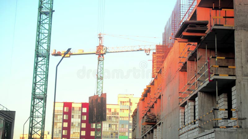 Construction Crane with Hanging Load of Concrete Slab for Construction ...