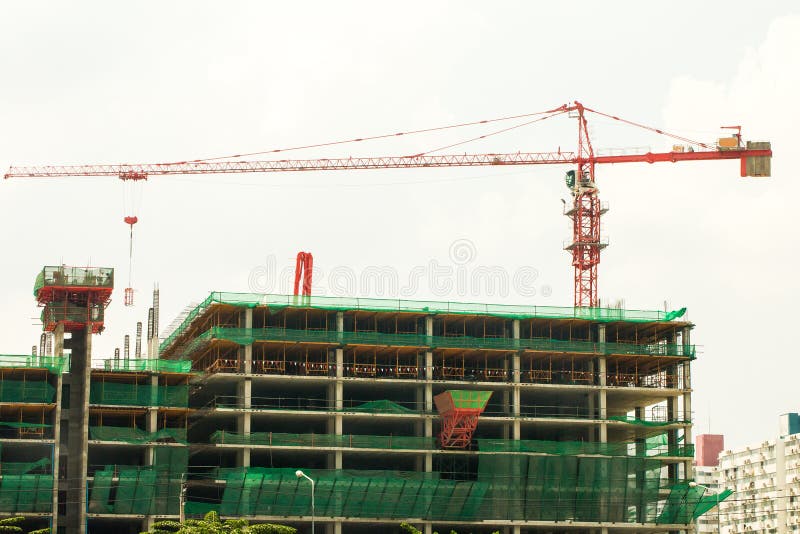 Construction Crane on a High Rise Stock Image - Image of laborers ...