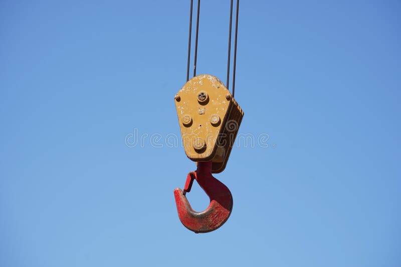 Construction Crane. Crane Hook Hanging from Two Cables Against Blue Sky ...