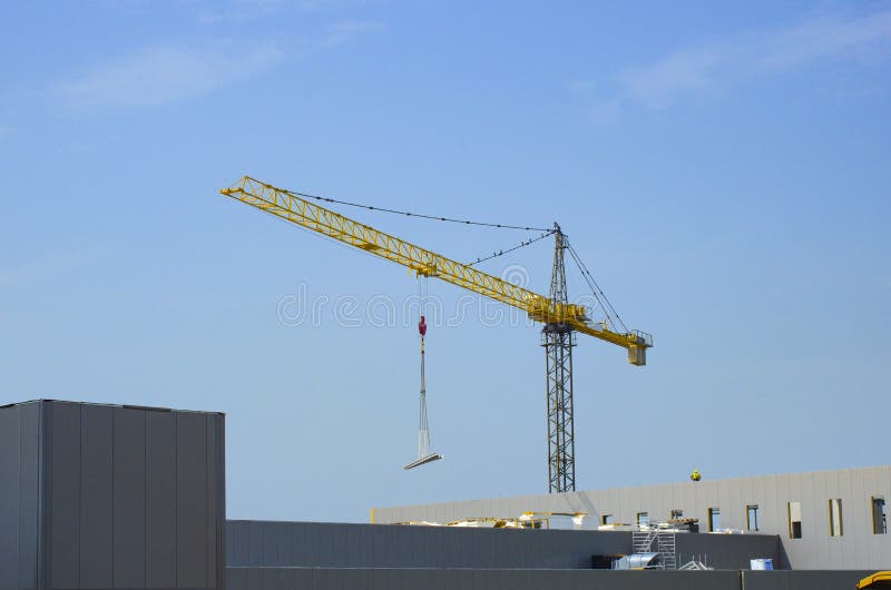 Construction Crane Lifting Heavy Objects Ar Worksite Stock Photo ...