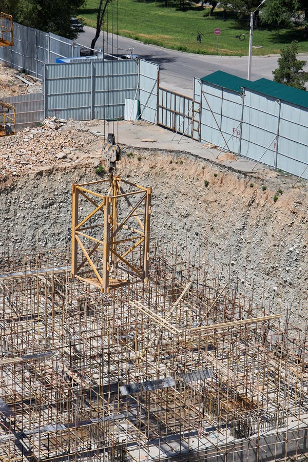 Construction Crane Lifts an Additional Section on a Hook To Increase ...