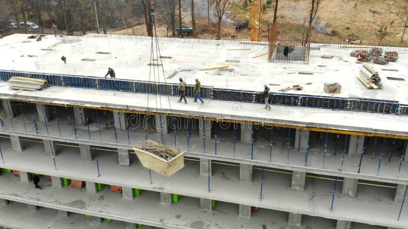 The Crane Lifts the Load. a Construction Crane Lifts Ventilation Units ...