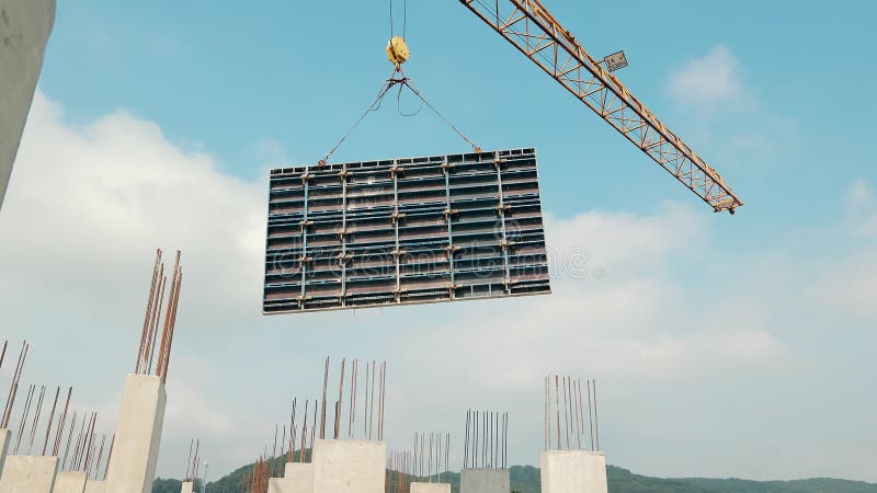 A Construction Crane Lifts the Structure To Support the Monolith. Work ...