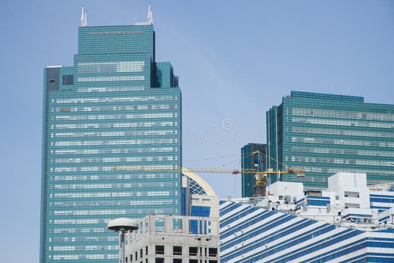 Construction Crane among Modern Urban High-rise Buildings. Stock Image ...