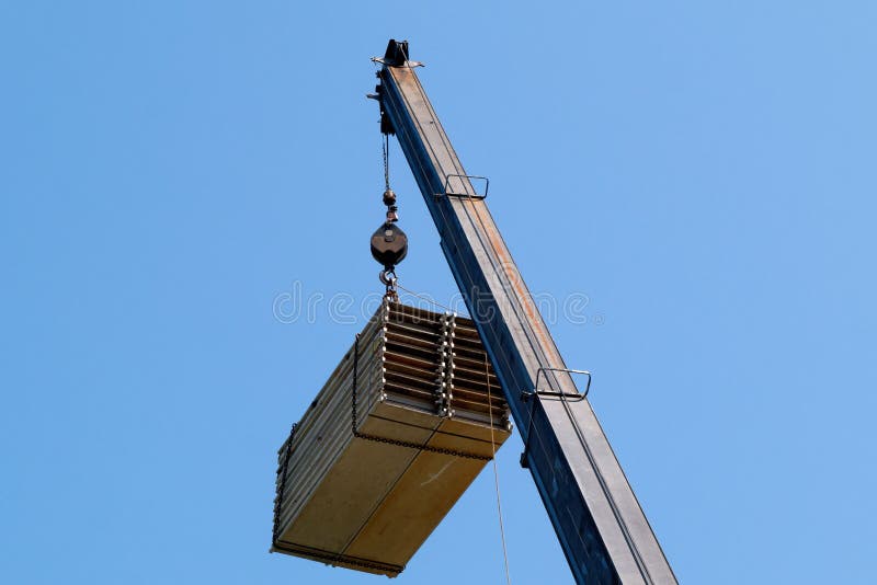 Large Construction Crane Loads Materials for a New Development Site ...