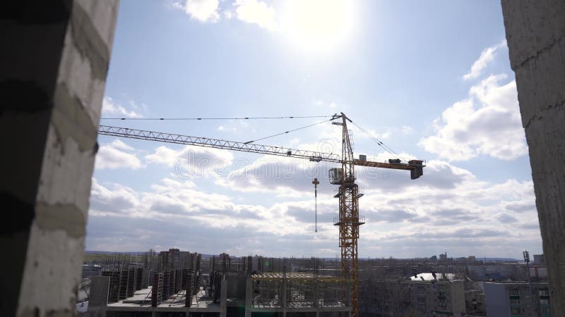 Construction Crane Operating on Sunny Day with Clouds Stock Video ...