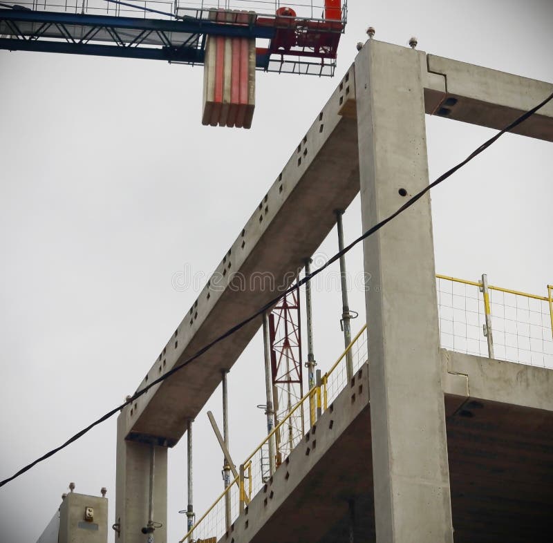 Construction Crane Over Concrete Building Carcass on White Sky Stock ...
