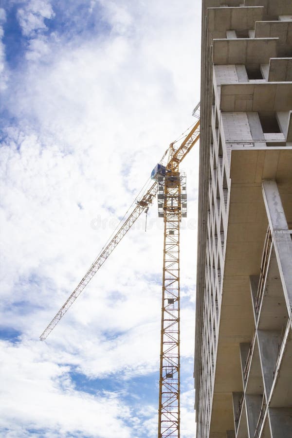 Construction Crane and Part of a Building Under Construction Stock ...