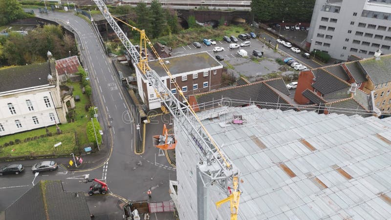 Construction Crane Rotating Over Building Site Stock Video - Video of ...