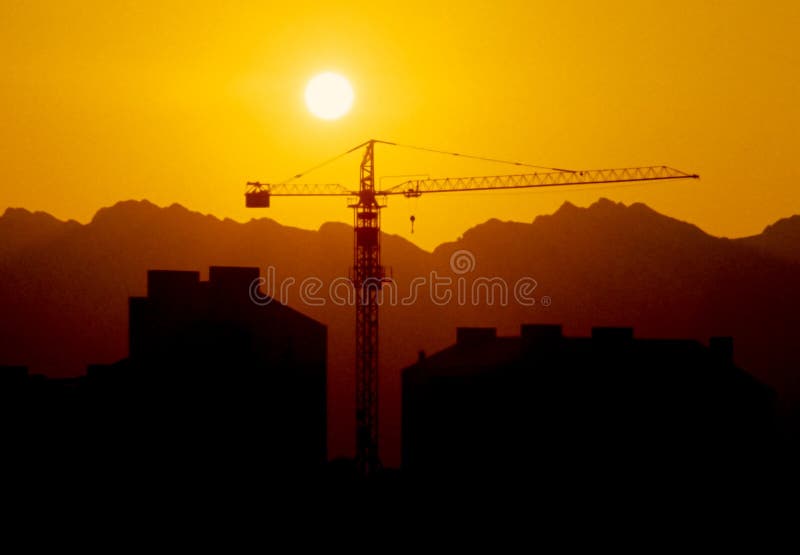 Construction Crane at Sunset Stock Photo - Image of scaffolding ...